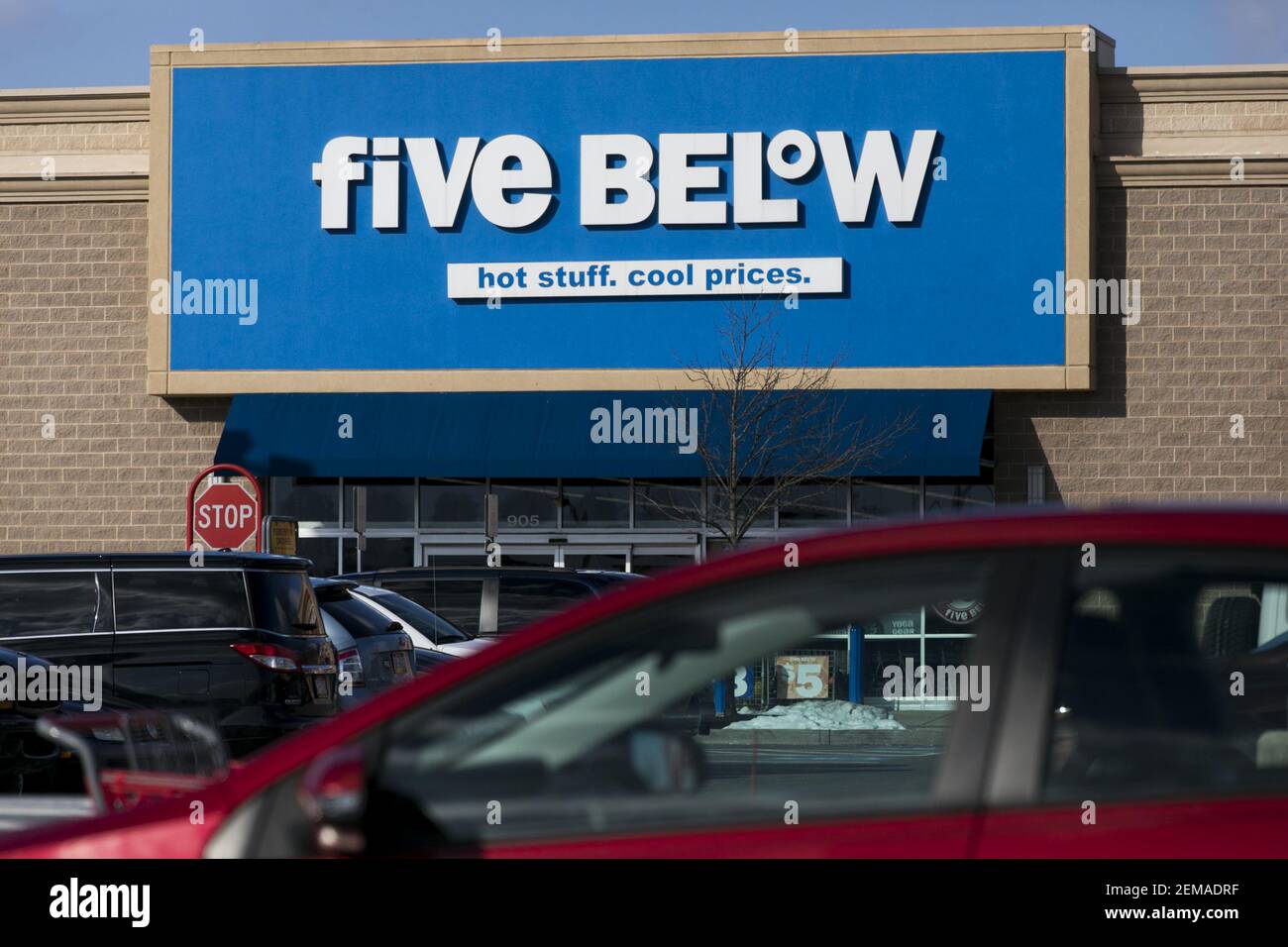 A logo sign outside of a Five Below retail store location in ...