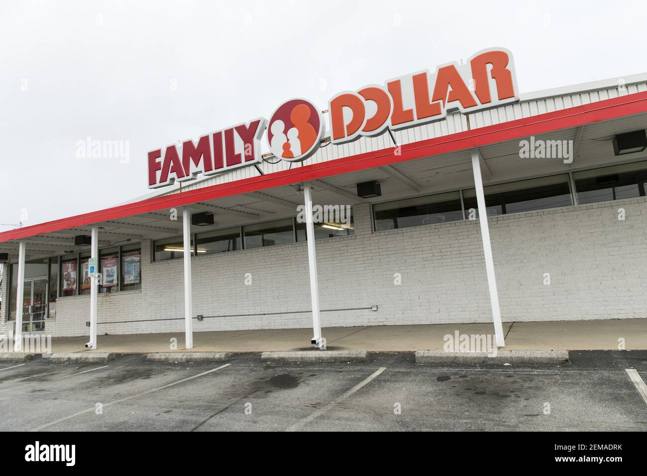 A logo sign outside of a Family Dollar retail store location in ...