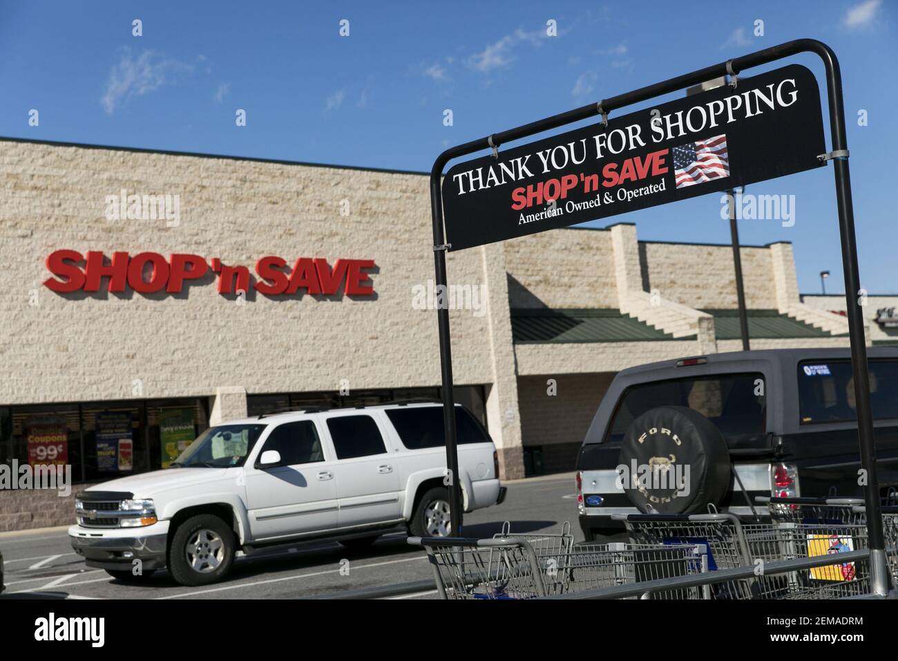 A logo sign outside of a SHOP 'n SAVE retail grocery store location in ...