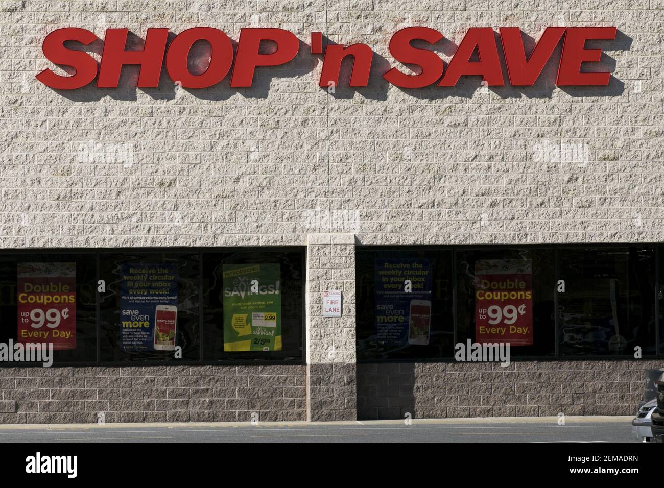 A logo sign outside of a SHOP 'n SAVE retail grocery store location in ...