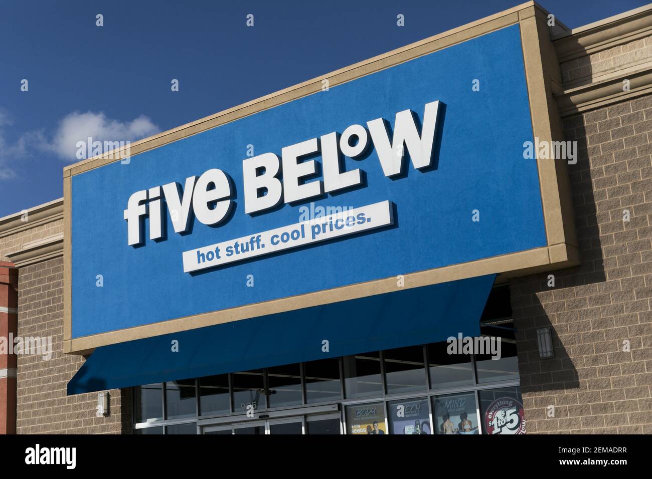 A logo sign outside of a Five Below retail store location in ...