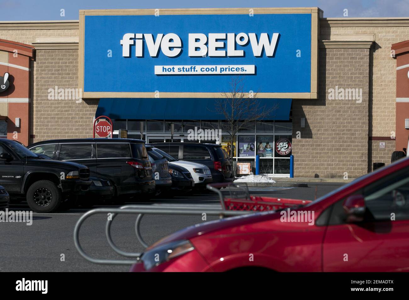 A logo sign outside of a Five Below retail store location in ...