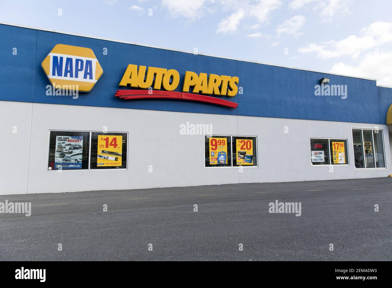 A logo sign outside of a NAPA Auto Parts retail store location in ...