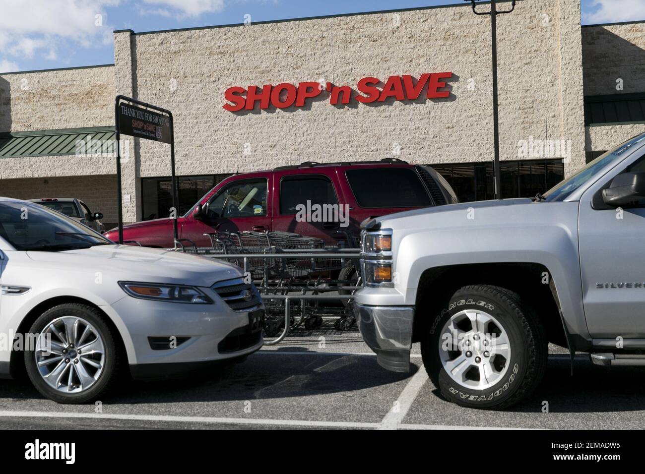 A logo sign outside of a SHOP 'n SAVE retail grocery store location in ...
