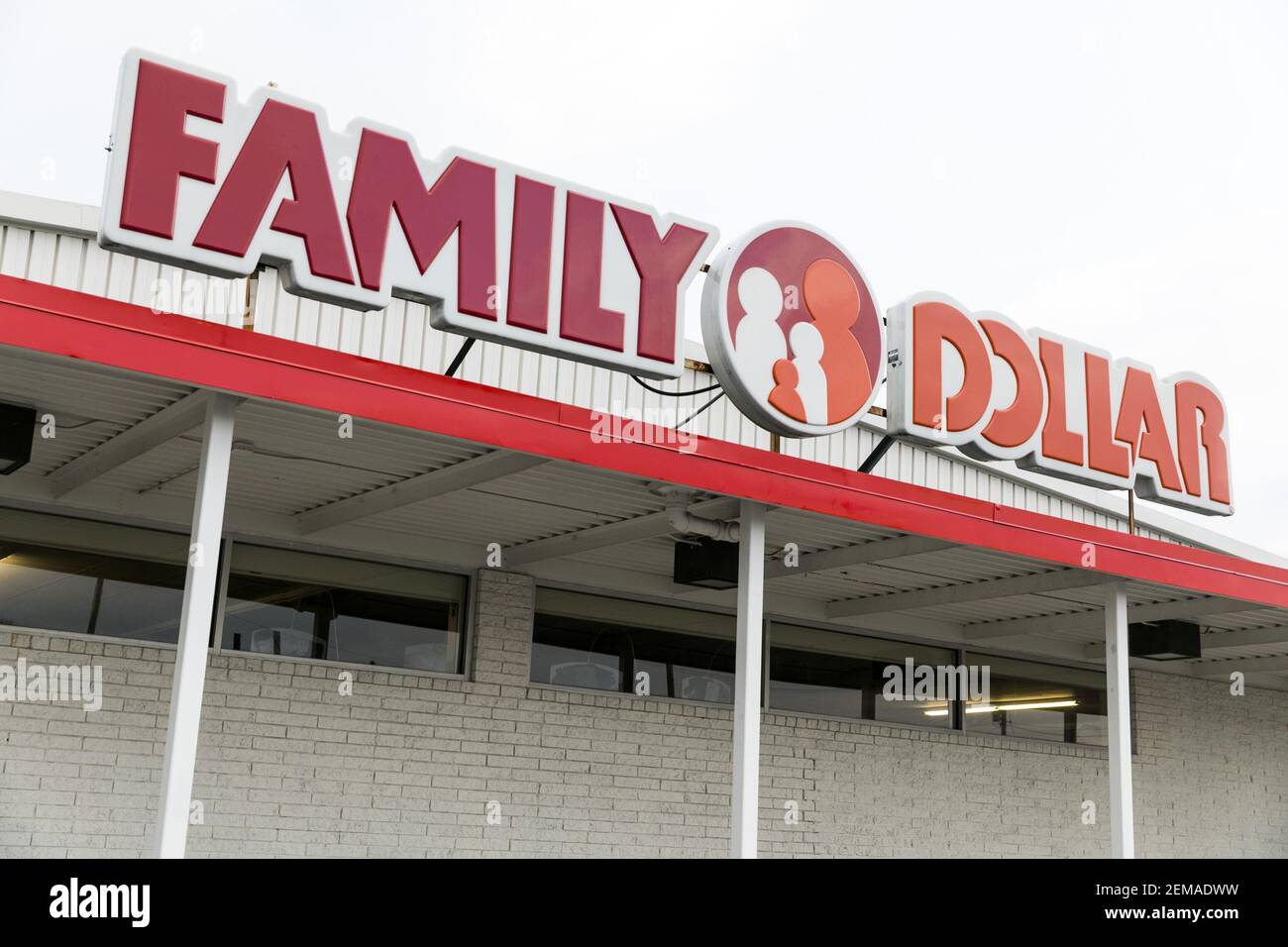 A logo sign outside of a Family Dollar retail store location in ...