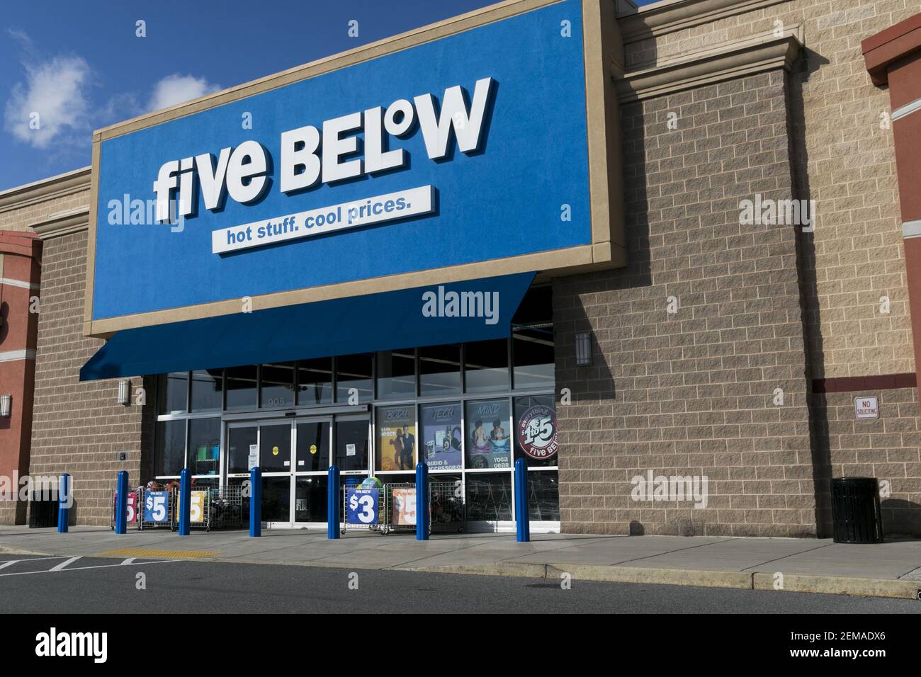 A logo sign outside of a Five Below retail store location in ...