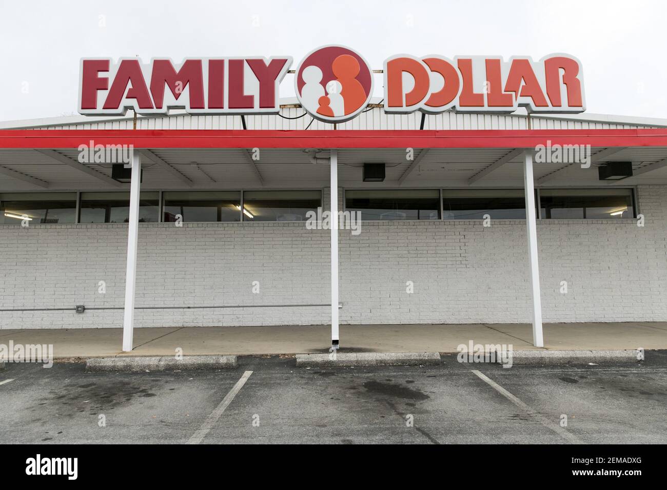 A logo sign outside of a Family Dollar retail store location in ...
