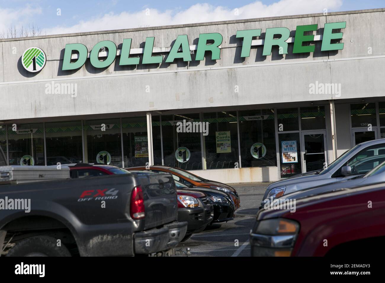 A logo sign outside of a Dollar Tree retail store location in ...