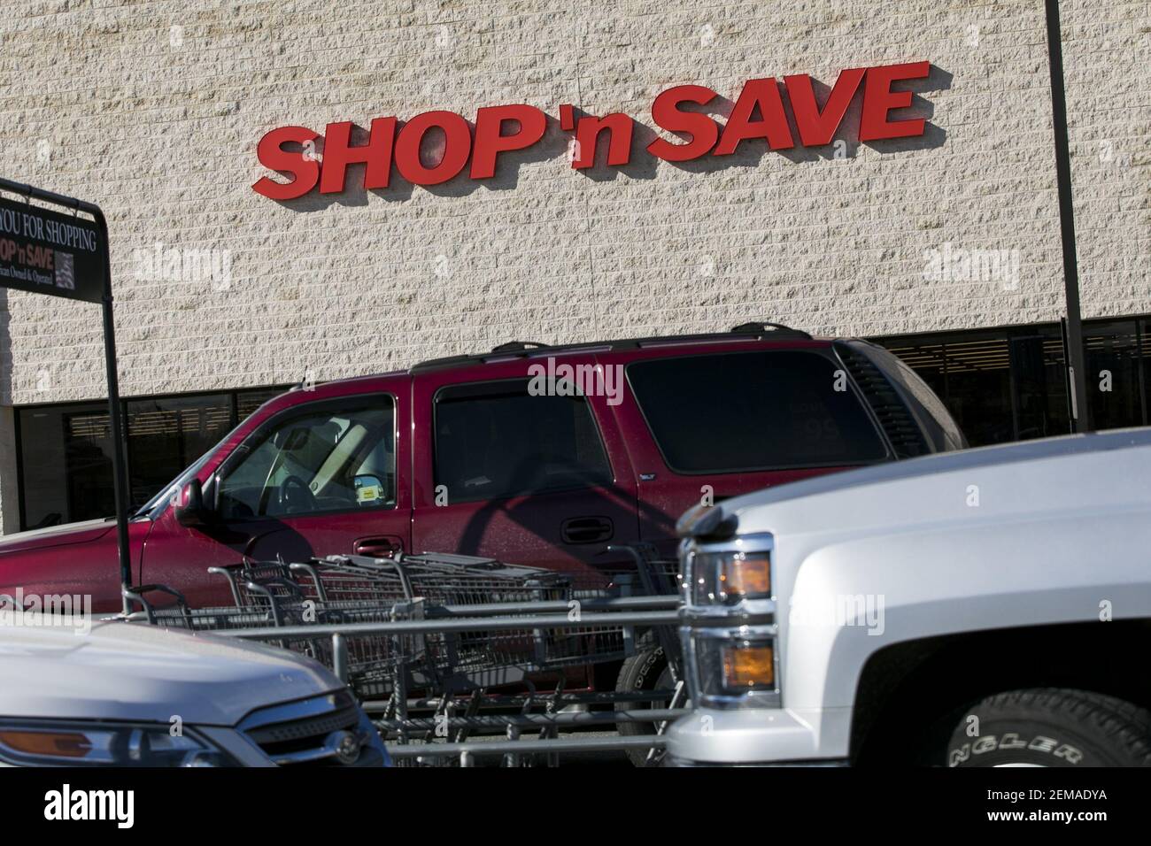 A logo sign outside of a SHOP 'n SAVE retail grocery store location in ...