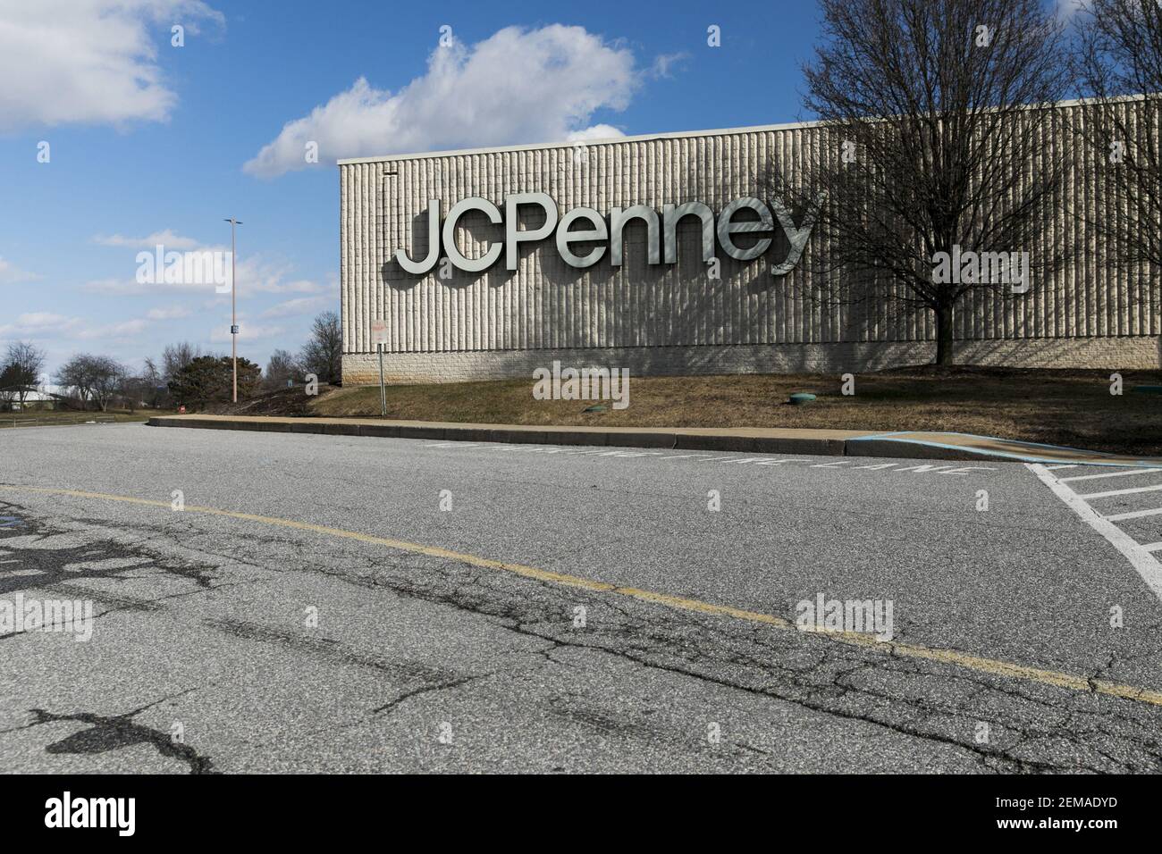 A logo sign outside of an abandoned JCPenney retail store location in ...