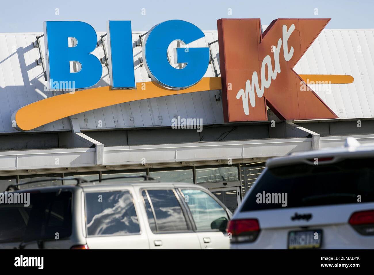 A logo sign outside of a Big Kmart retail store location in ...