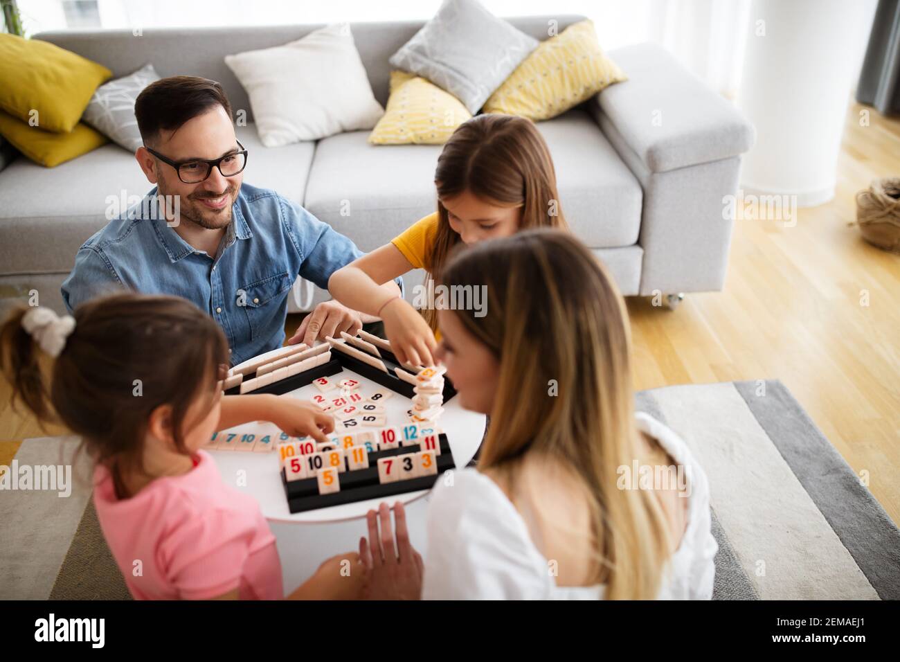 Happy family having fun time at home Stock Photo - Alamy