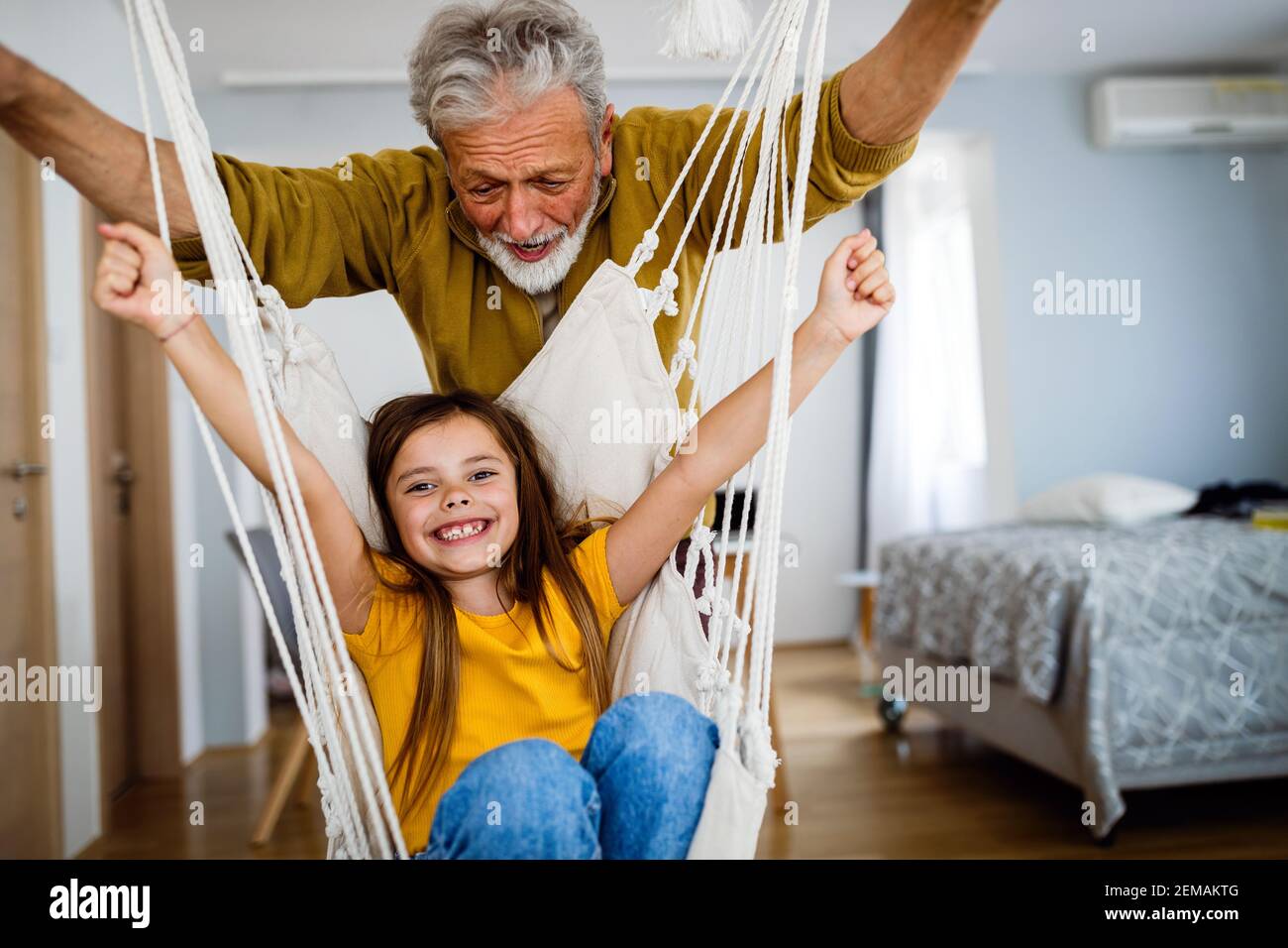 Happy grandparent having fun times with kid at home Stock Photo - Alamy