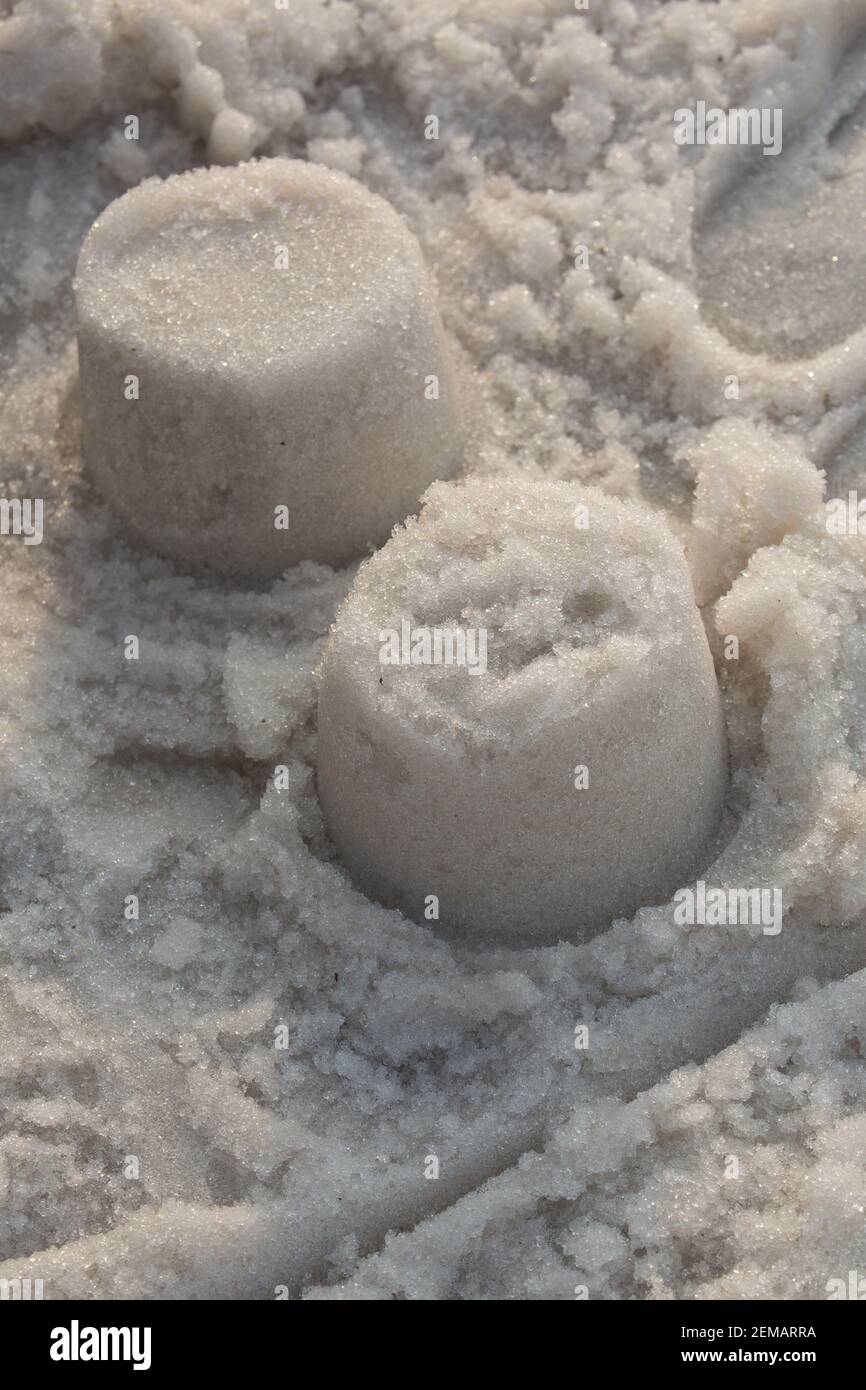 Hand made snow castles in the snow Stock Photo - Alamy