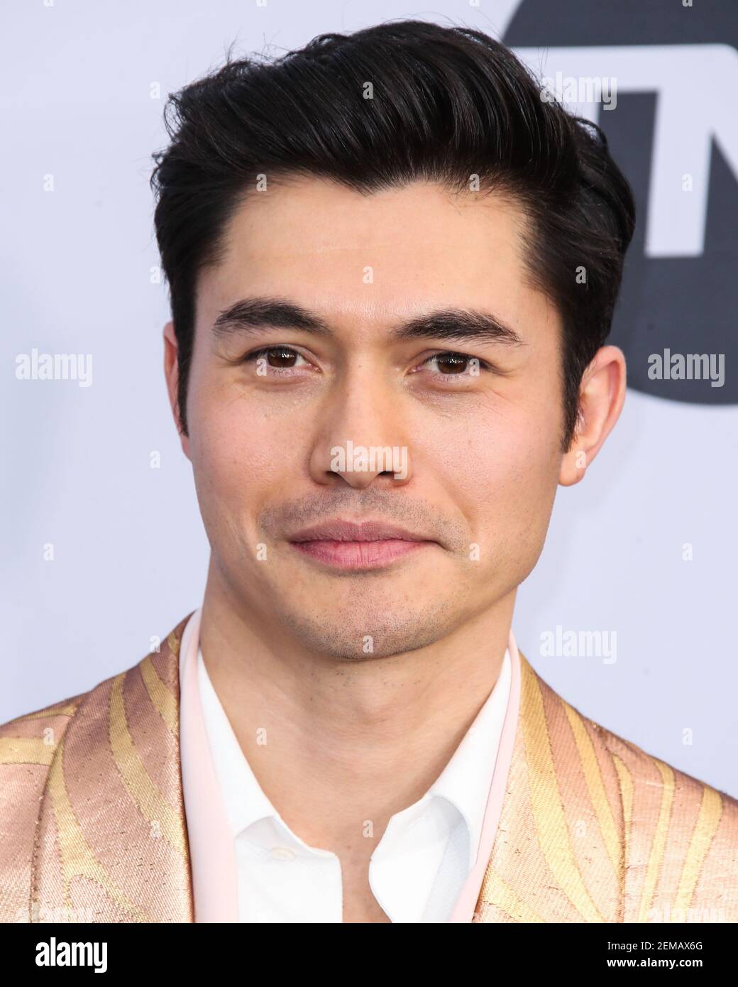 LOS ANGELES, CA, USA - JANUARY 27: Actor Henry Golding wearing Tom Ford ...