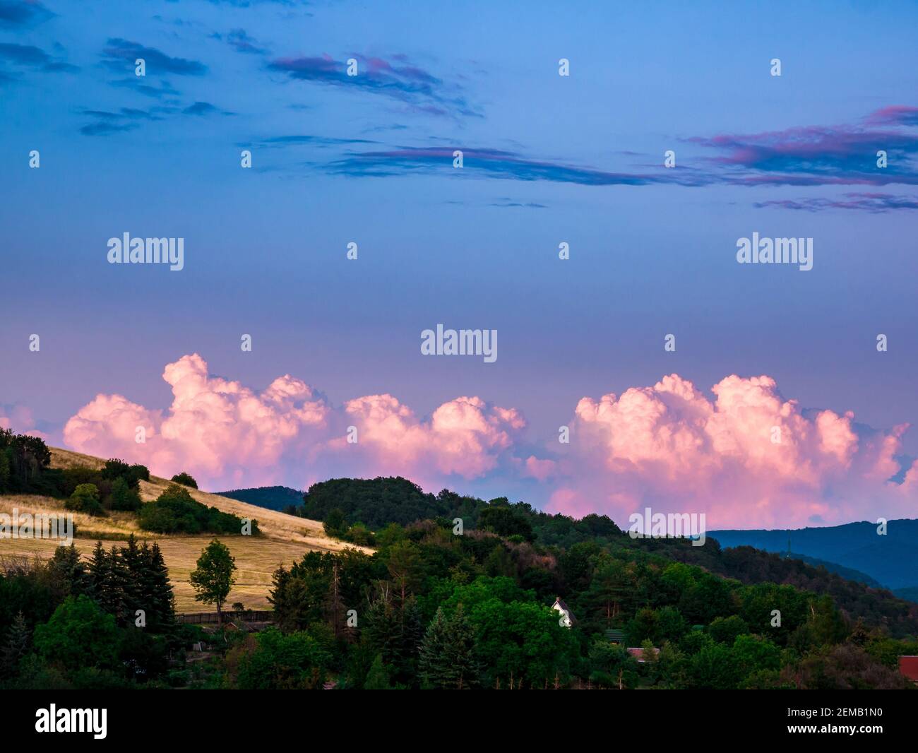 Hilly landscape at sunset hi-res stock photography and images - Alamy