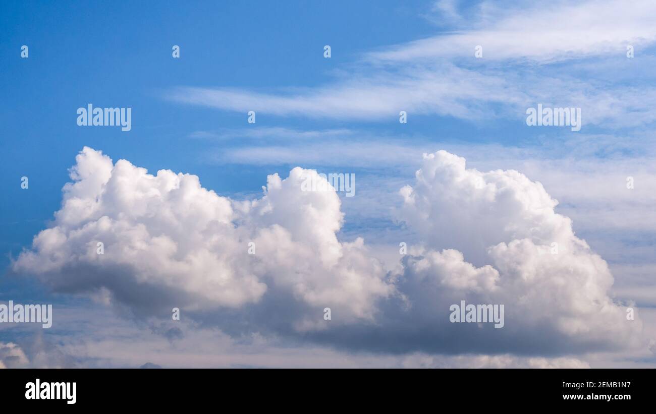 Beautiful long fluffy cloud in the blue sky Stock Photo - Alamy