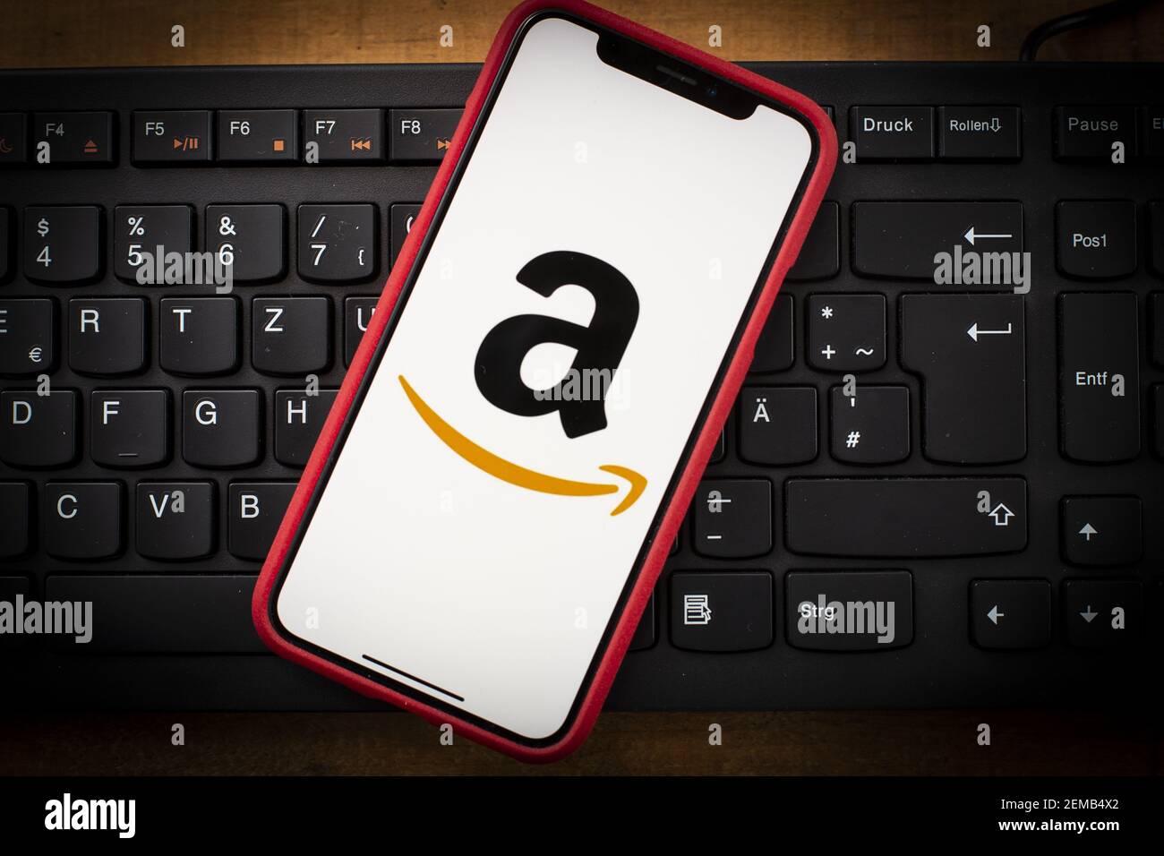 The Amazon logo is seen on a mobile phone in this photo illustration on ...
