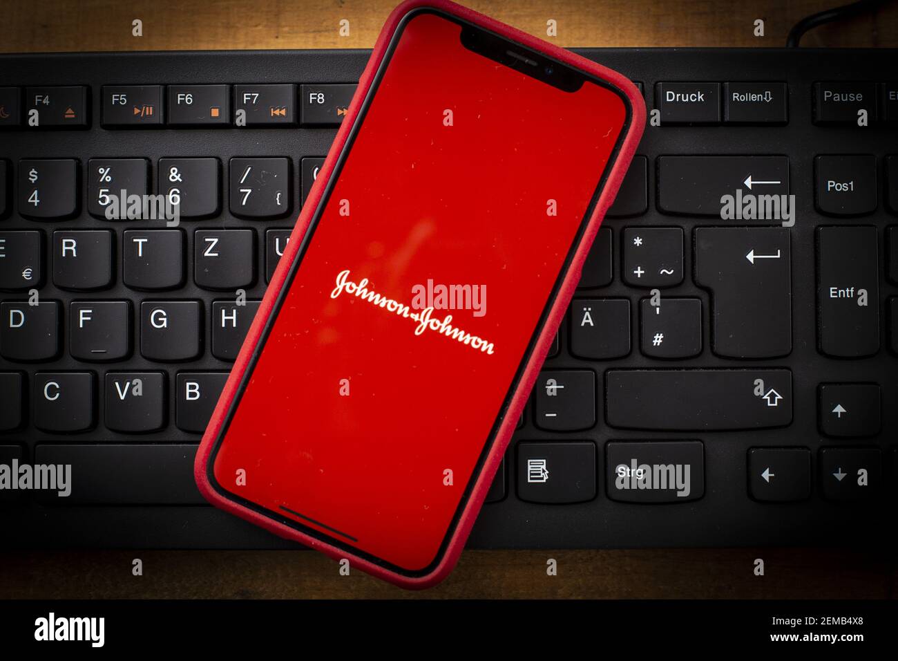 The Johnson and Johnson logo is seen on a mobile phone in this photo ...