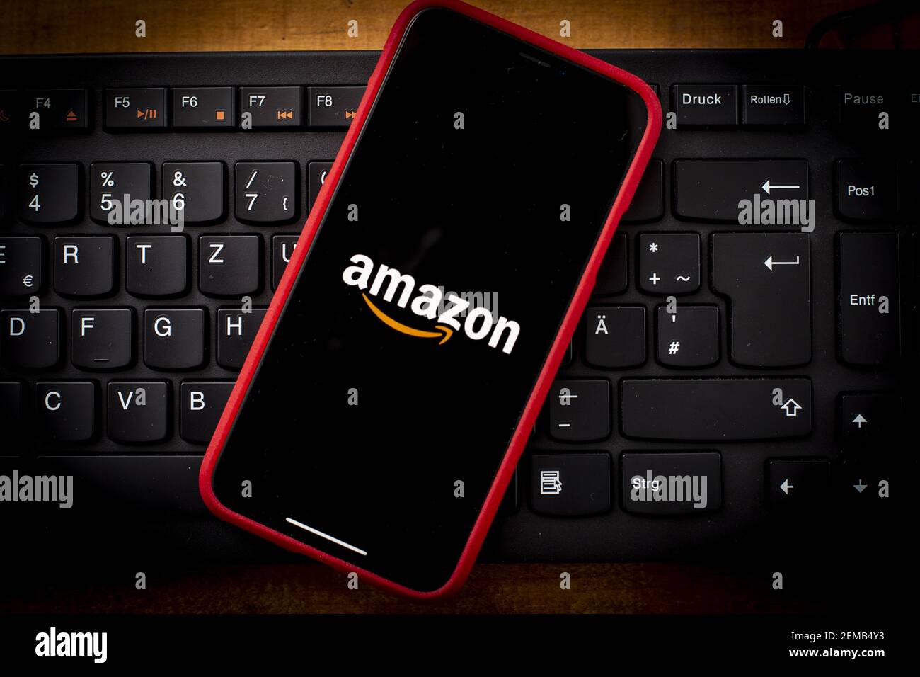 The Amazon logo is seen on a mobile phone in this photo illustration on ...