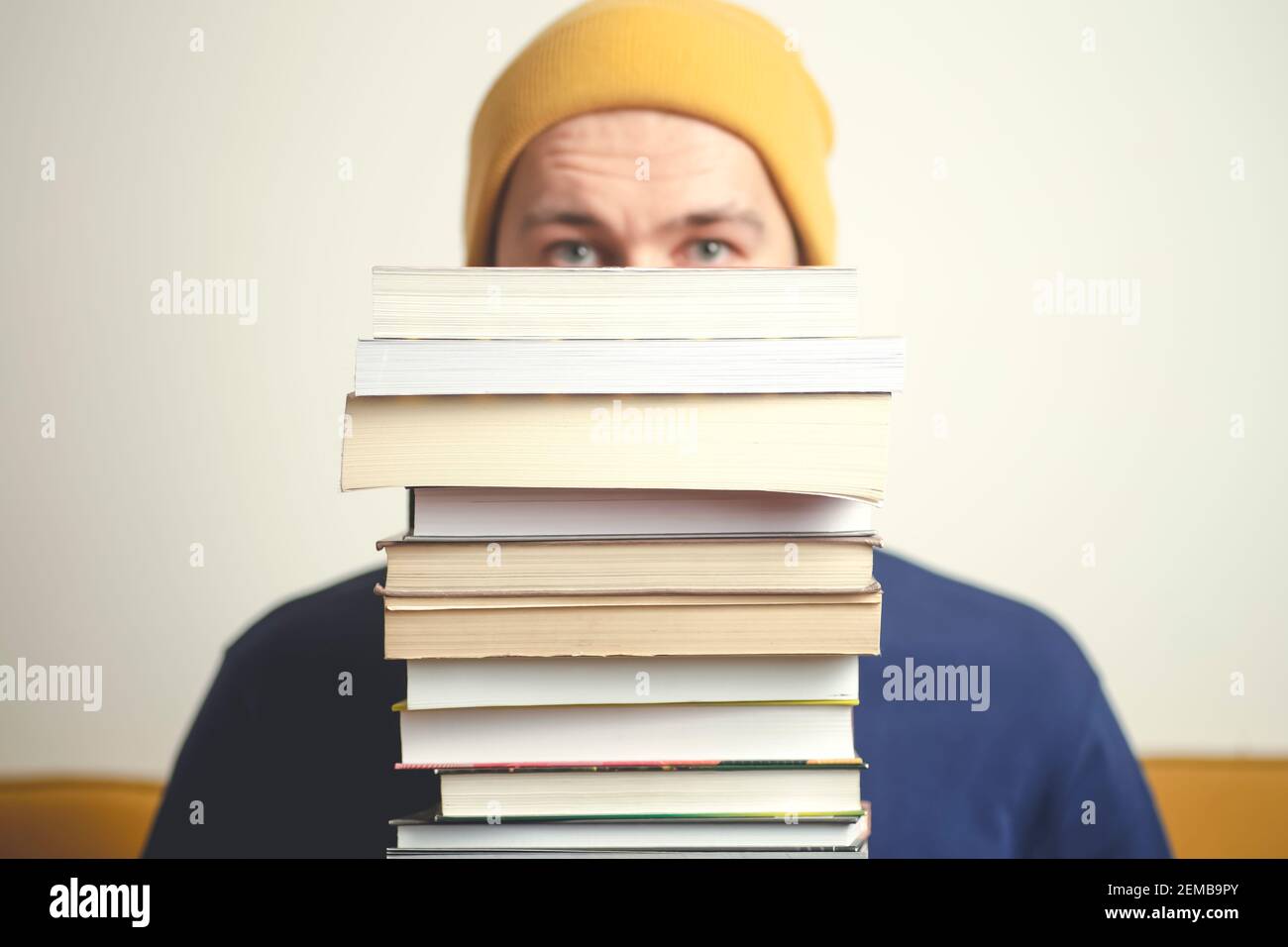 Student with books on a school background. Education, reading and study ...