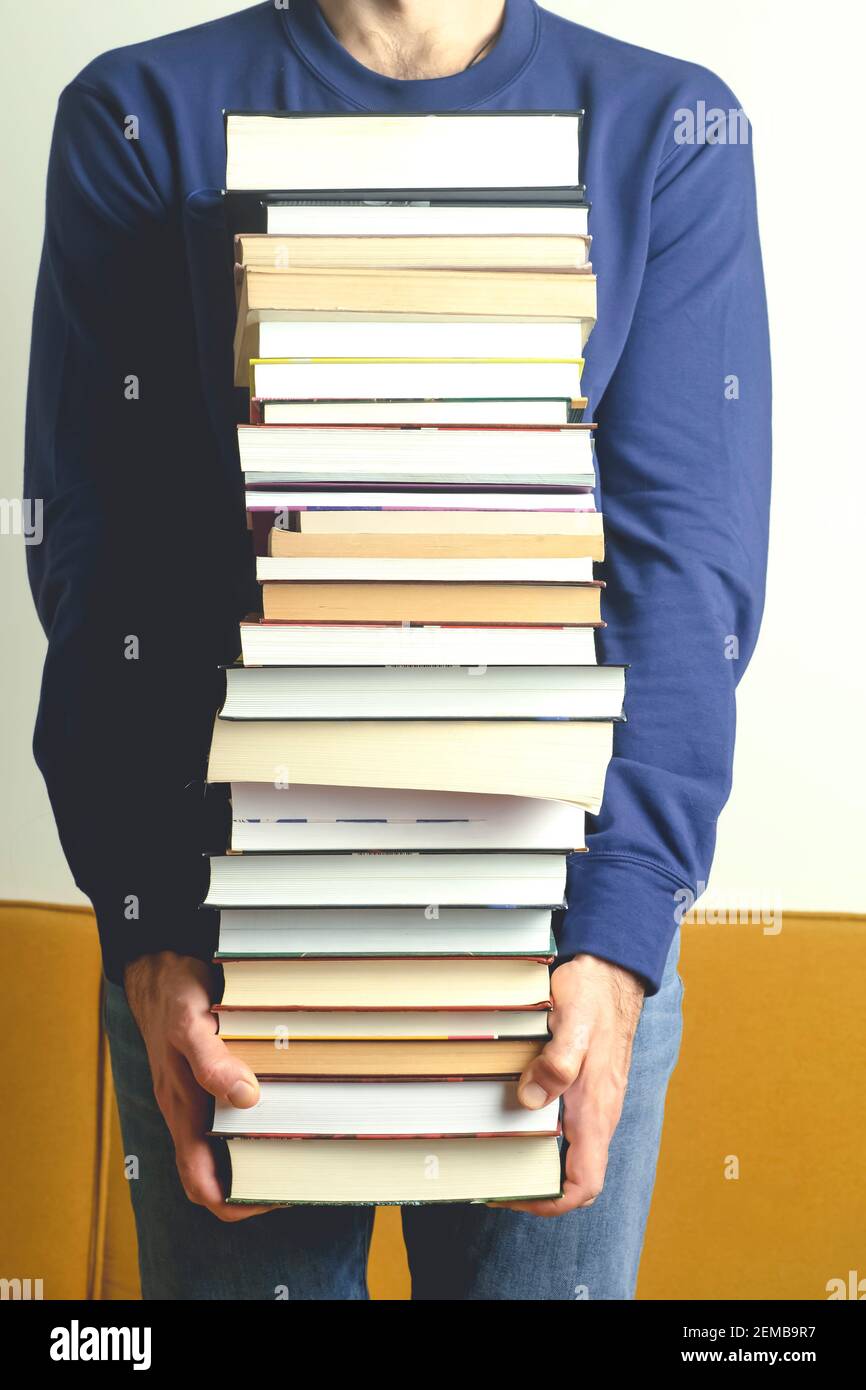 Student with books on a school background. Education, reading and study ...