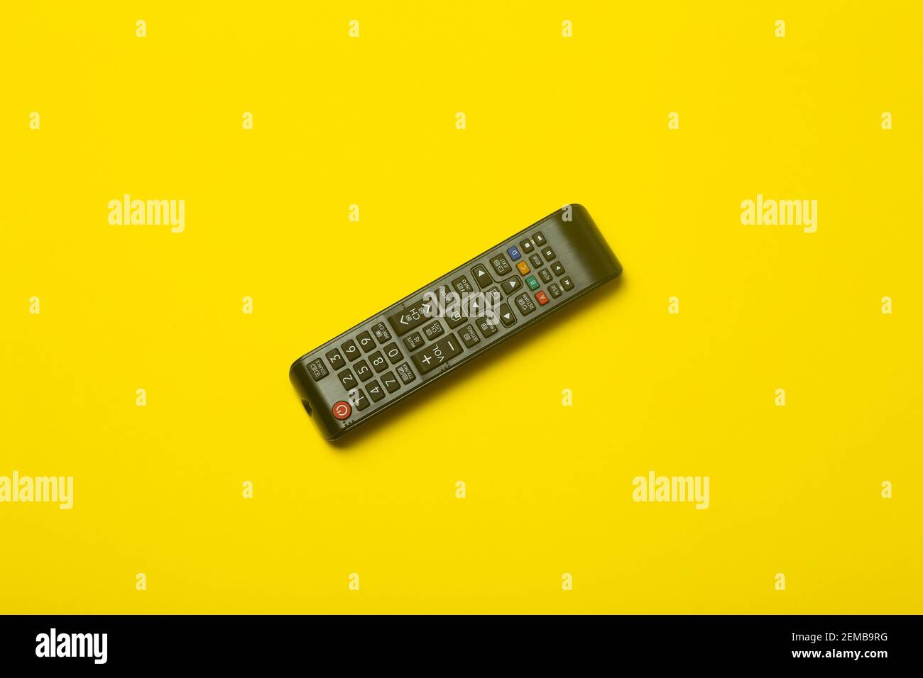 TV remote control on a yellow background. Cinema, entertainment, TV ...