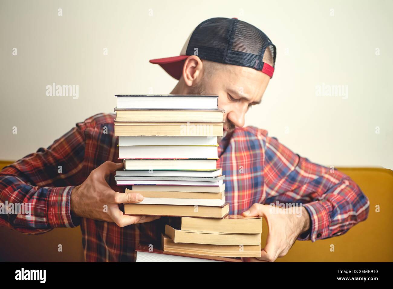 Student with books on a school background. Education, reading and study ...
