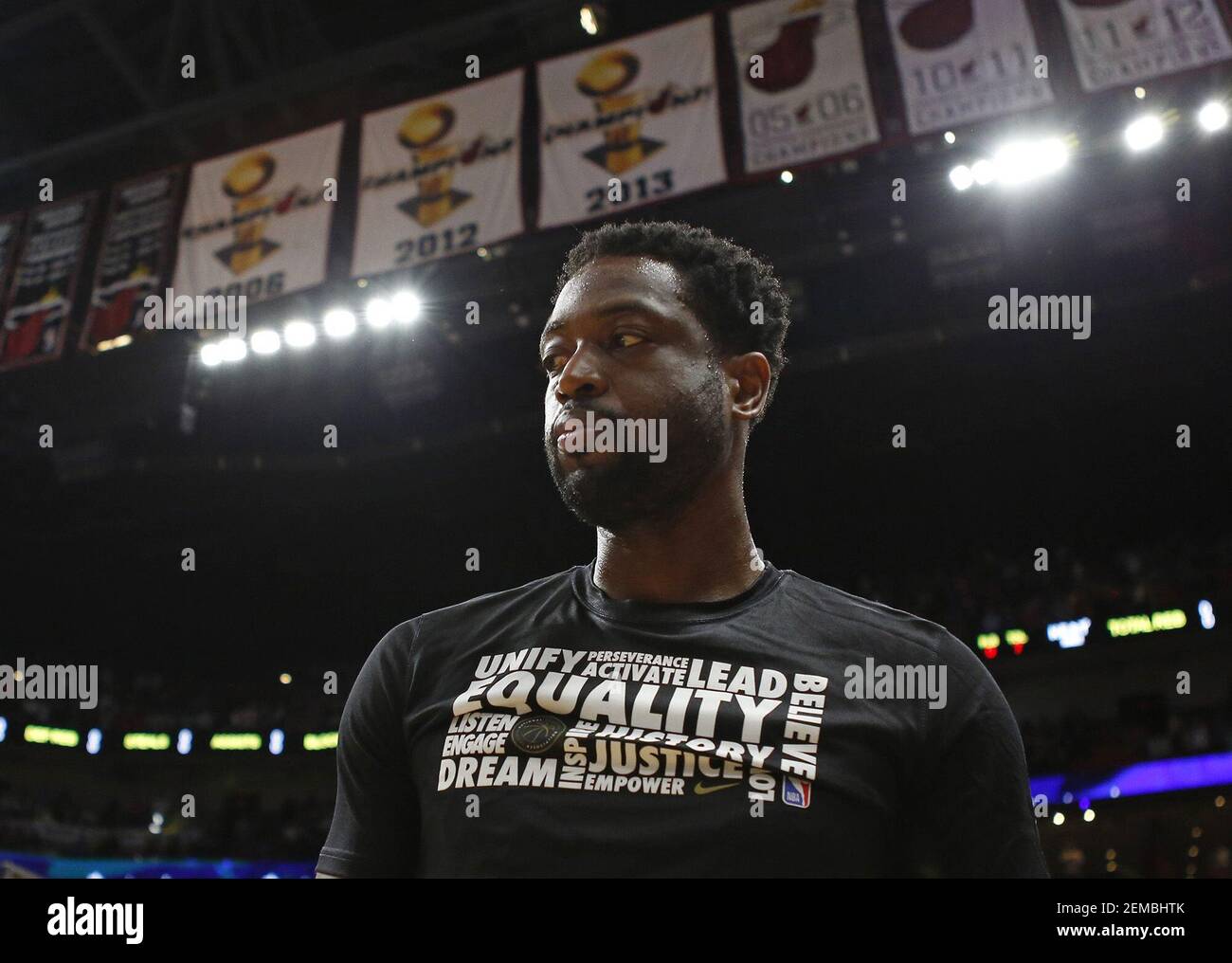 The Miami Heat's Dwyane Wade listens to the national anthem before the ...