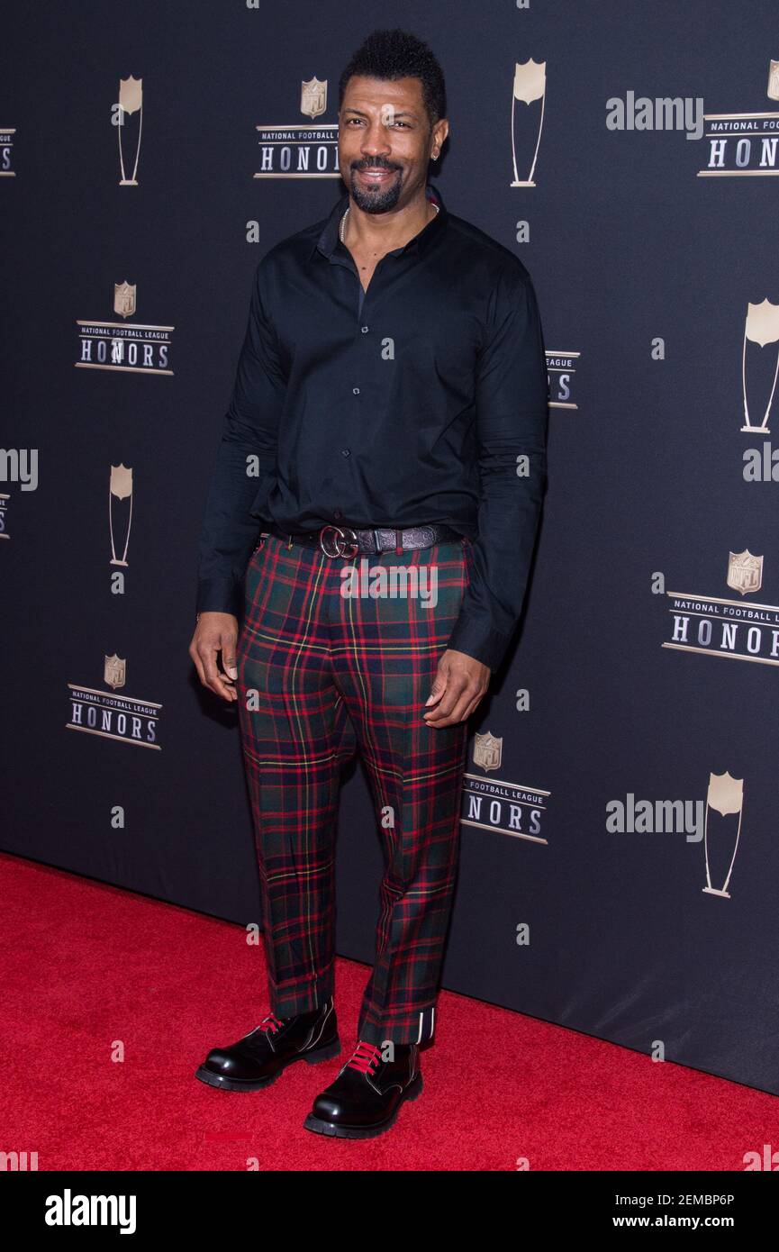 Deon Cole walking the red carpet at the NFL Honors event held at the ...