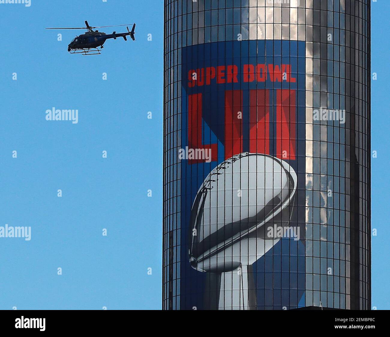 A law enforcement helicopter flys past the Westin hotel, keeping an eye ...