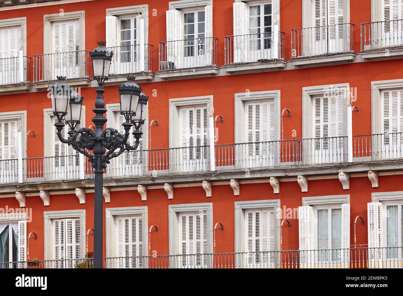 Classic red color facade in Madrid city center. Spain. Outdoor Stock ...