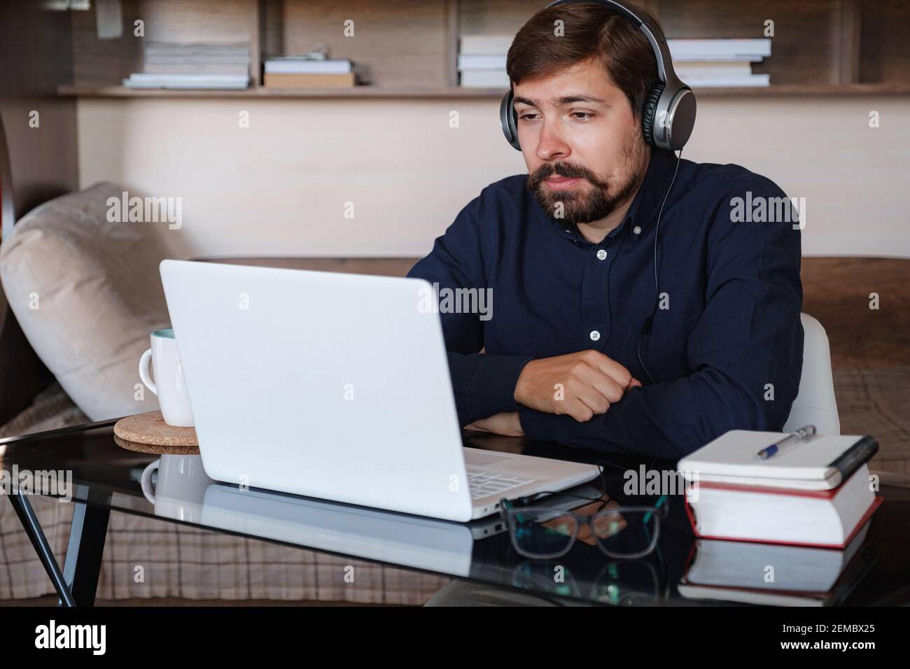 Happy male student online teacher wear headphone talk video calling ...