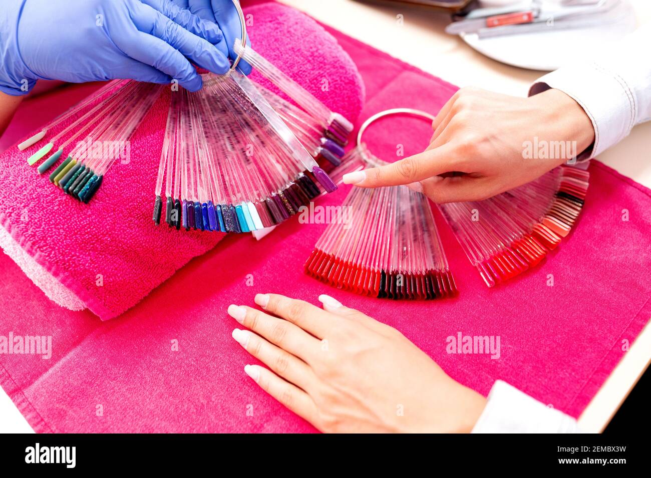 Choosing of the right color for her nails, nail manicure Stock Photo ...