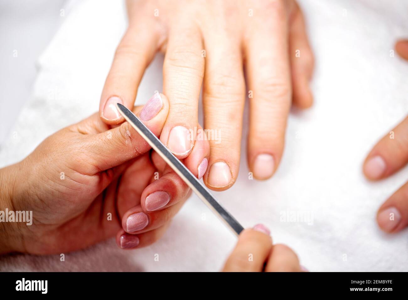 Close up hands manicurist filing hi-res stock photography and images ...