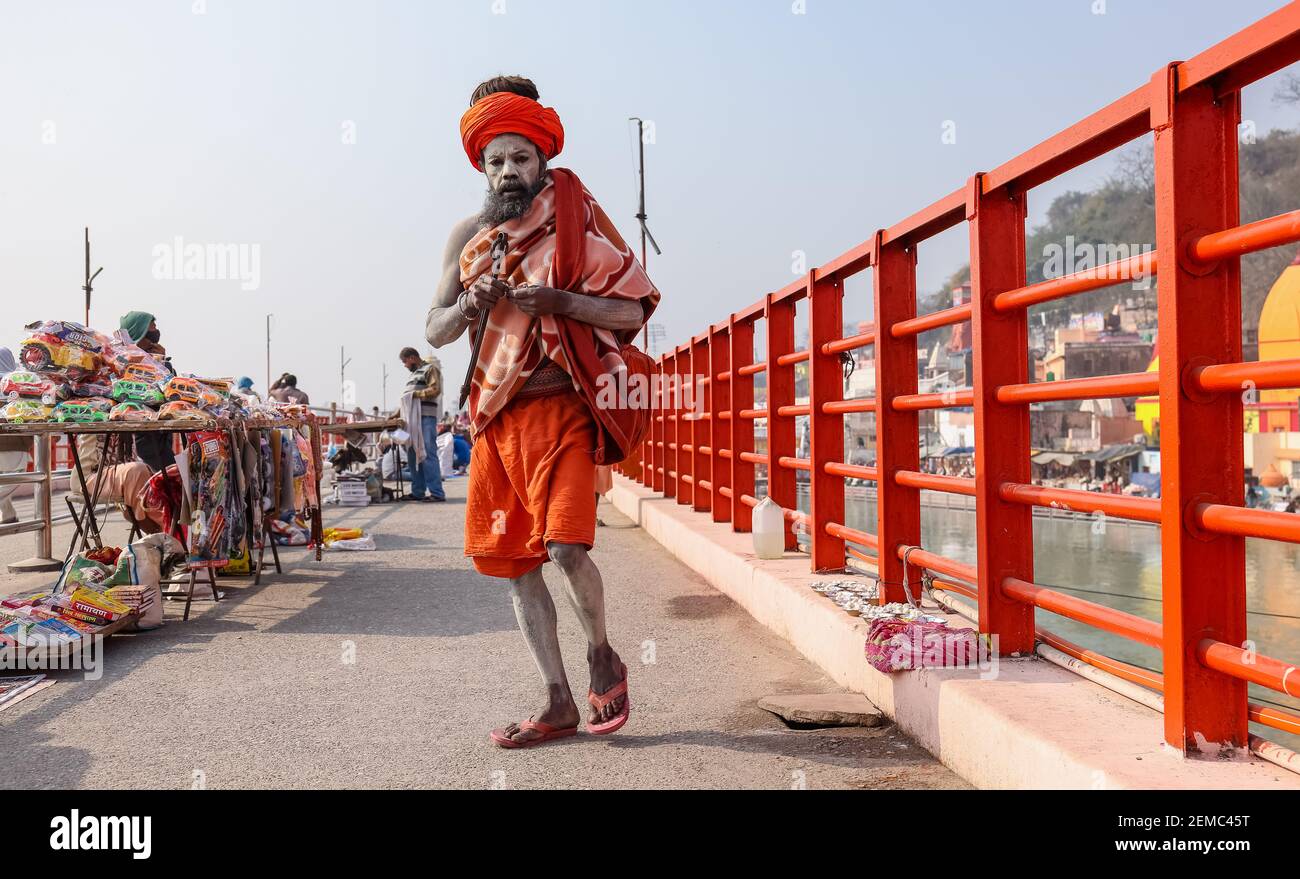 Indian Sadhu in traditional saffron dress participating in Kumbh ...