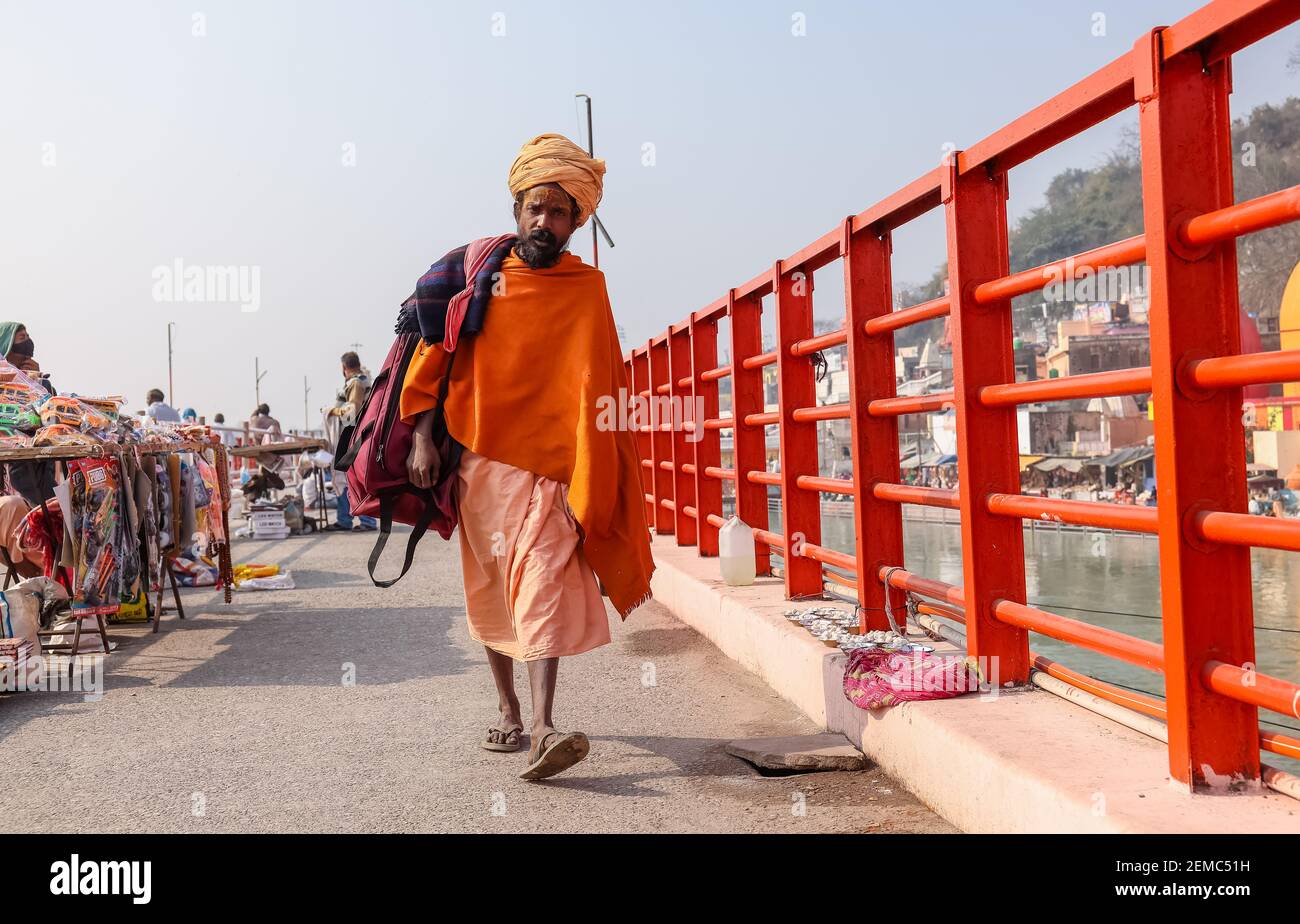 Indian Sadhu in traditional saffron dress participating in Kumbh ...