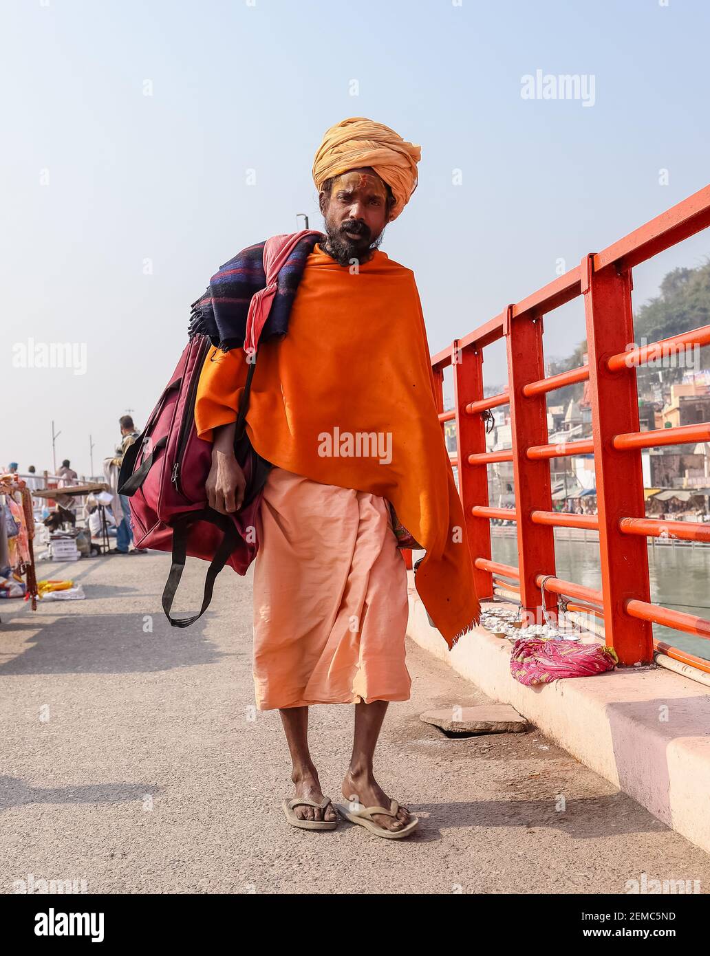 Indian Sadhu in traditional saffron dress participating in Kumbh ...