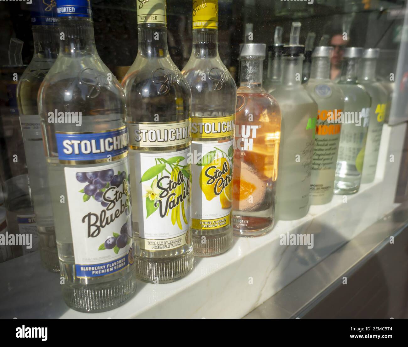 A selection of bottles of top shelf liquor displayed in the window of a ...