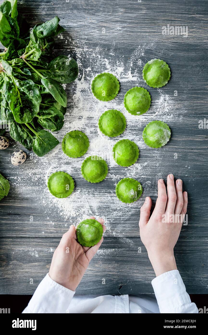 chef step by step, preparing a green ravioli with the addition of ...
