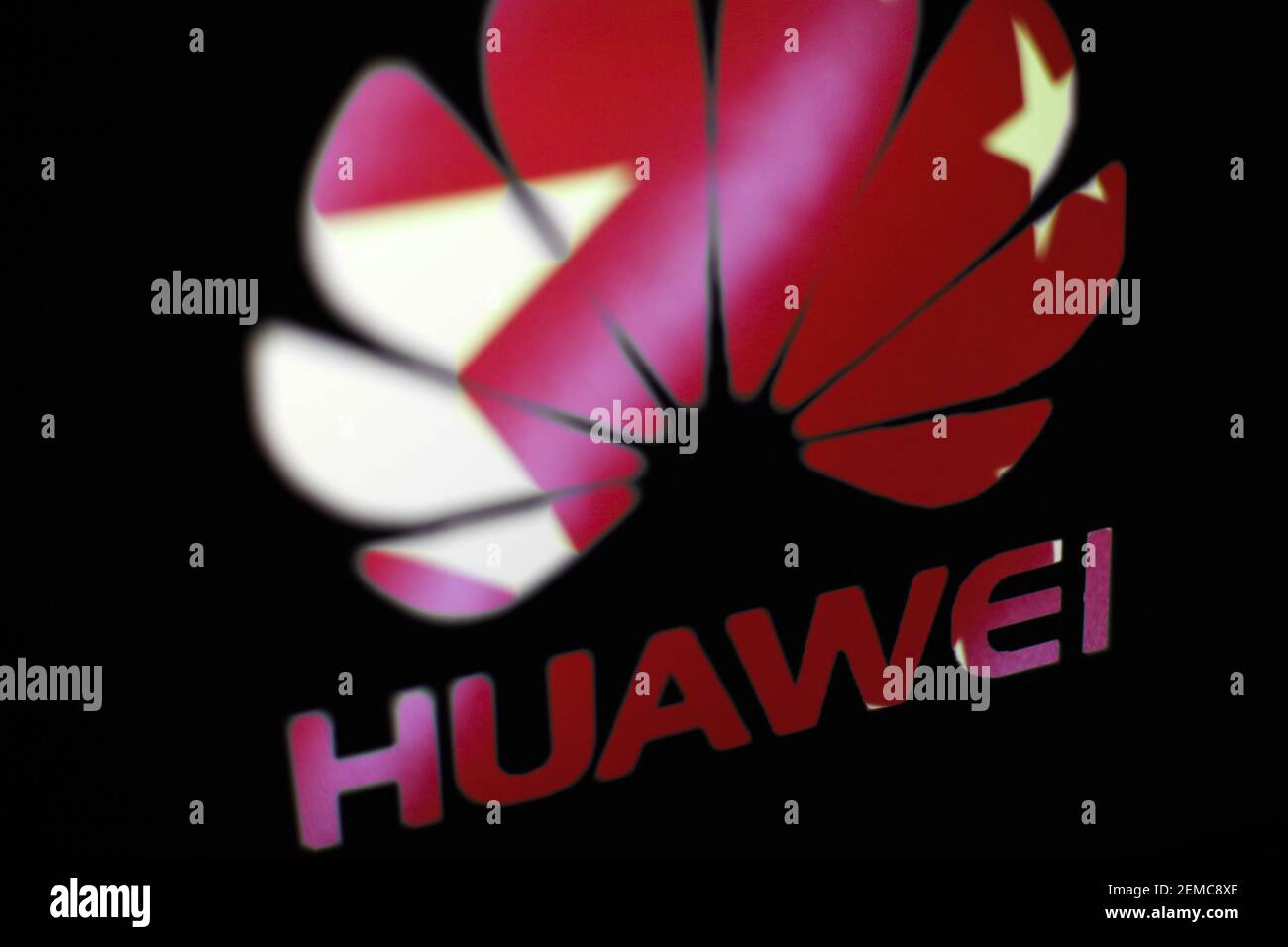 The Chinese flag is seen together with the Huawei logo superimposed in ...