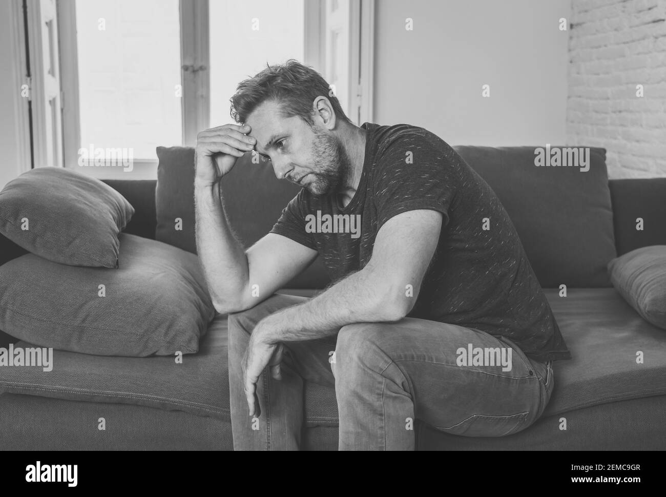 Unhappy depressed caucasian male crying in living room couch feeling ...