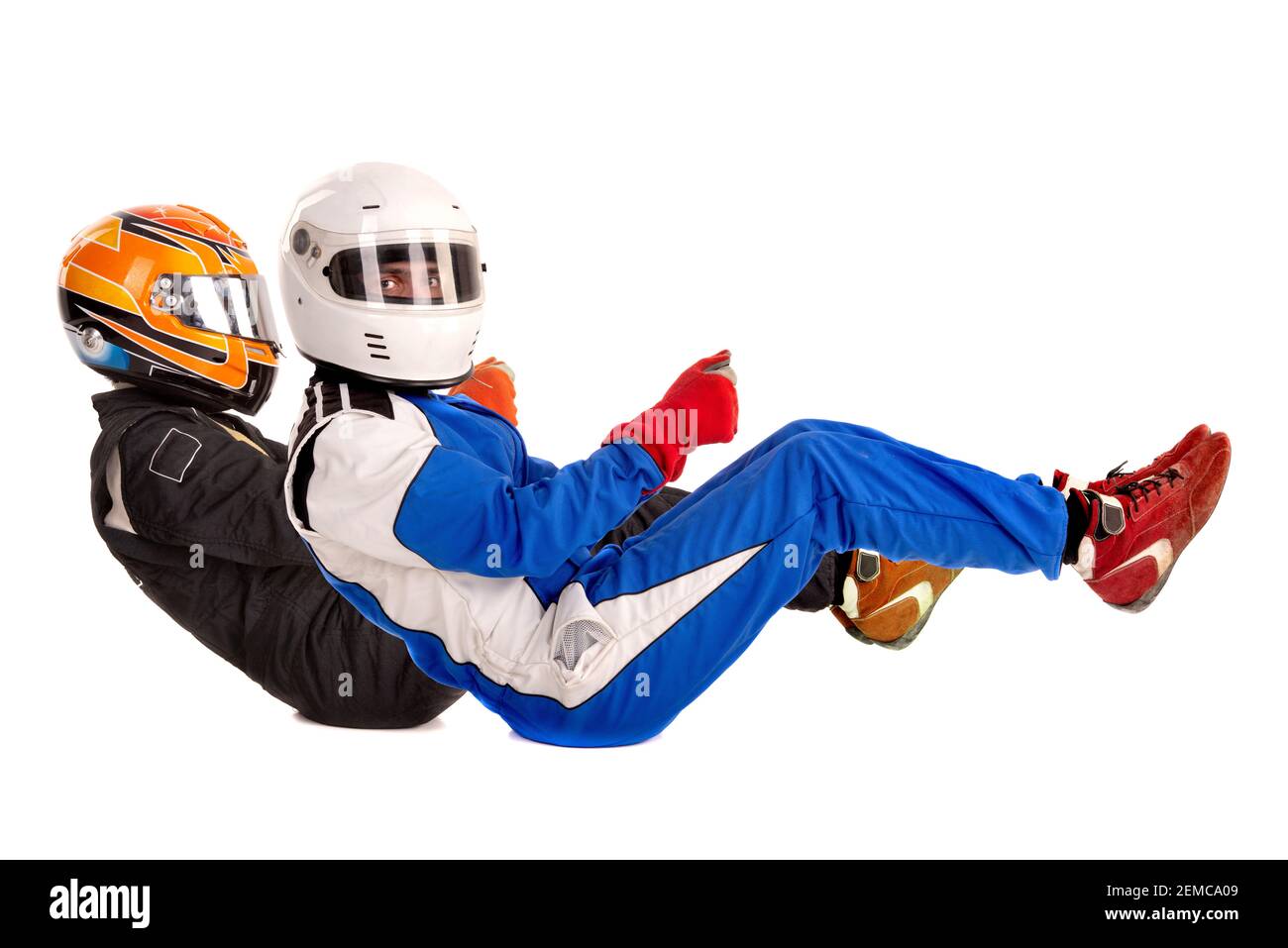Racing drivers in racing position with complete gear isolated in white ...