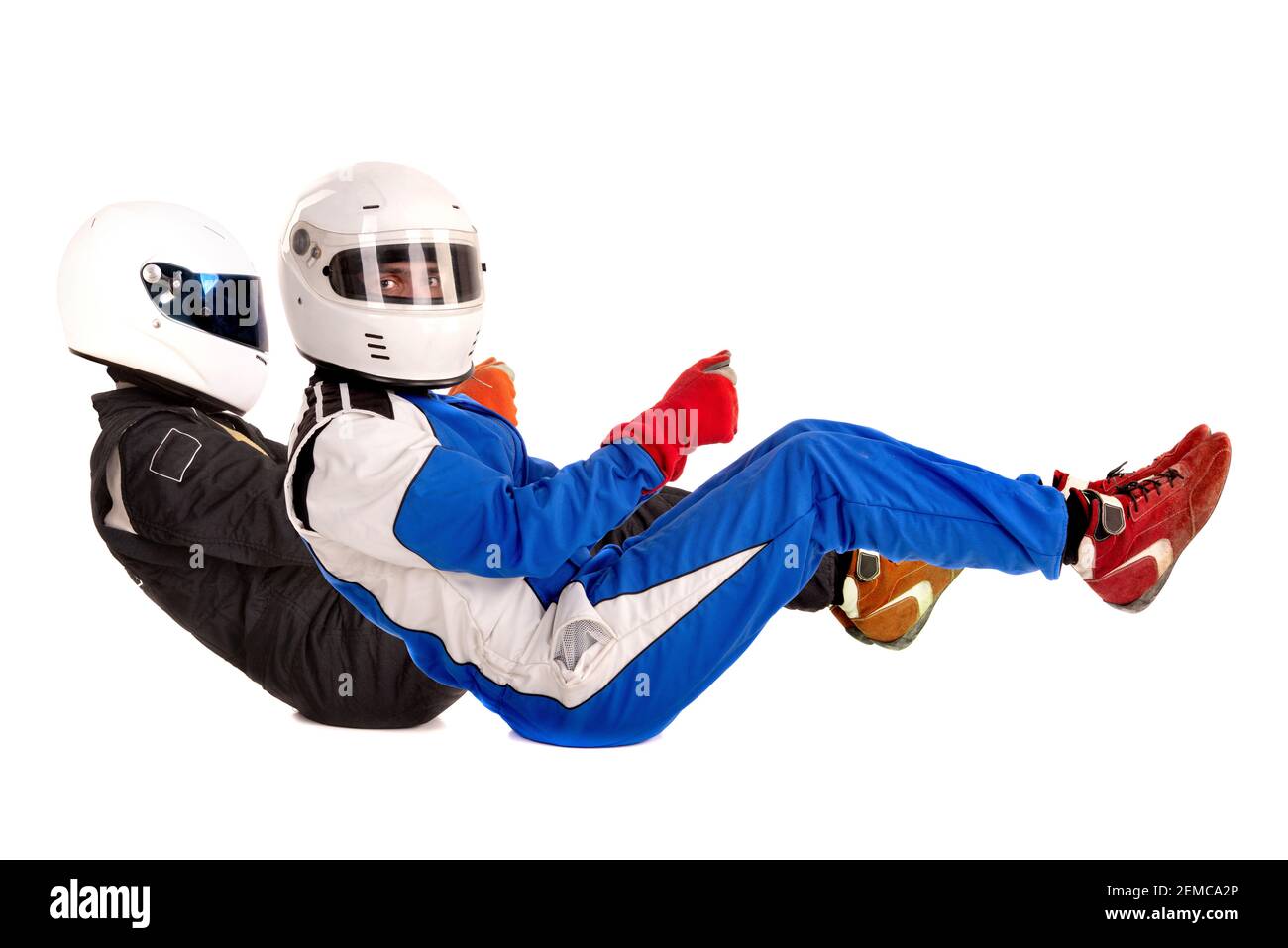 Racing drivers in racing position with complete gear isolated in white ...