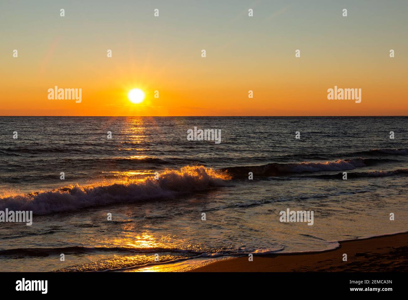 Cloudless sunset over ocean. Natural colors Stock Photo - Alamy