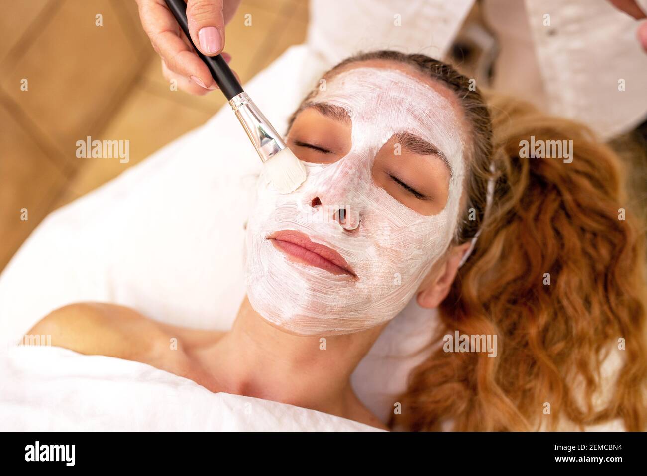 Spreading facial beauty mask hi-res stock photography and images - Alamy