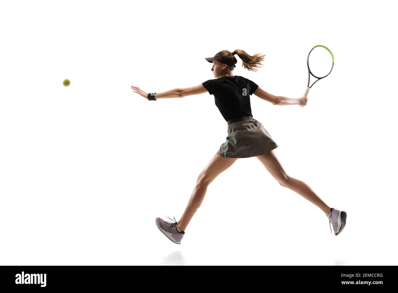 Competitive. Young caucasian professional sportswoman playing tennis on ...