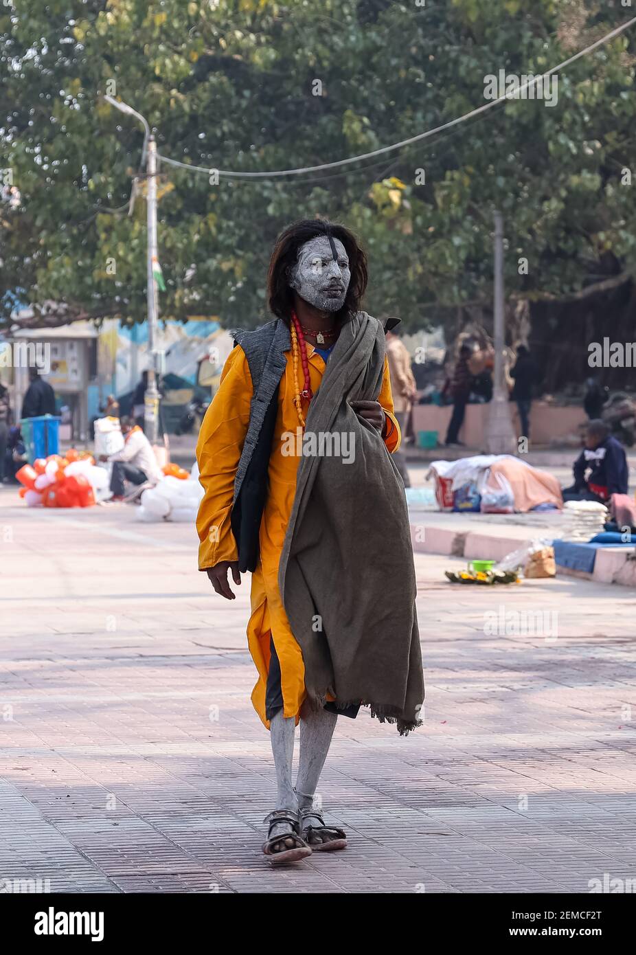 Indian Sadhu in traditional saffron dress participating in Kumbh ...