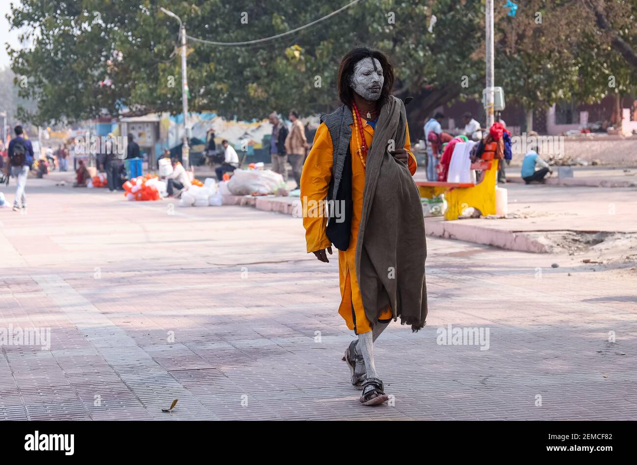 Indian Sadhu in traditional saffron dress participating in Kumbh ...