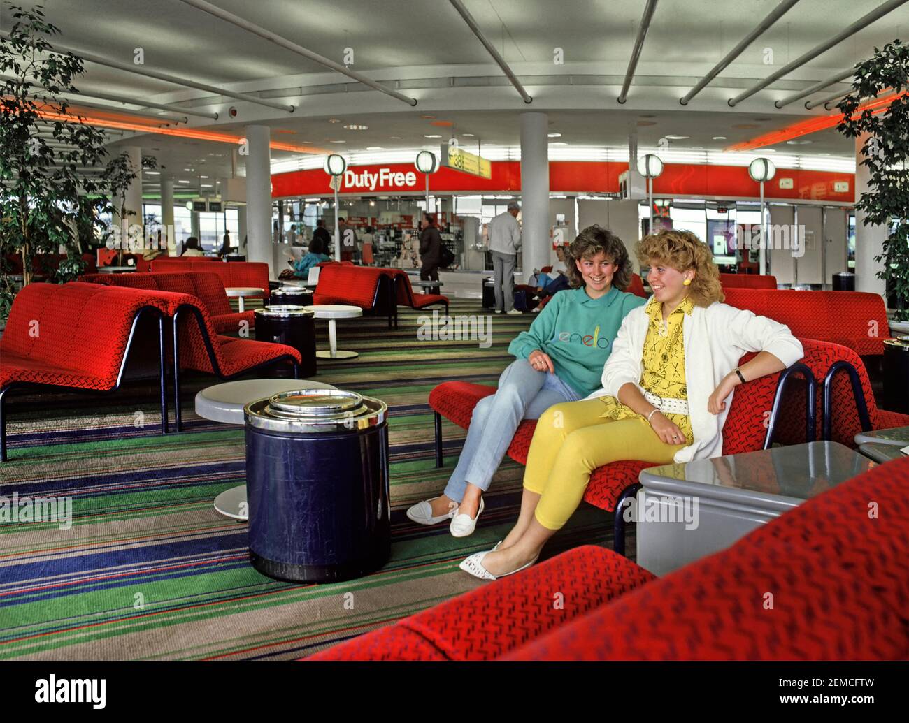 Two model released teenage girls talking and wearing 1980s fashion ...